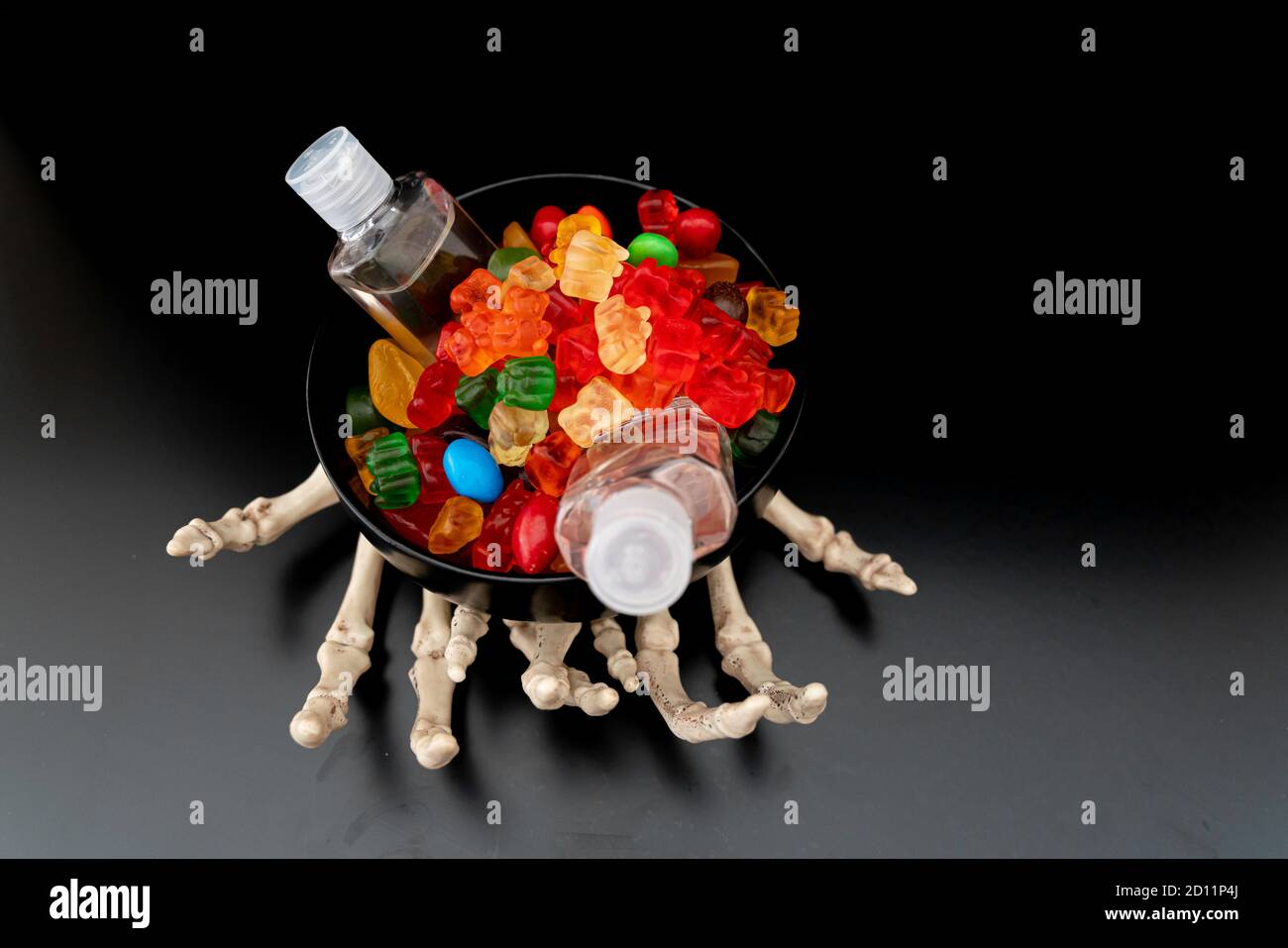 Skeleton Claw hands with Candy and Hand Sanitizer - Halloween Concept ...
