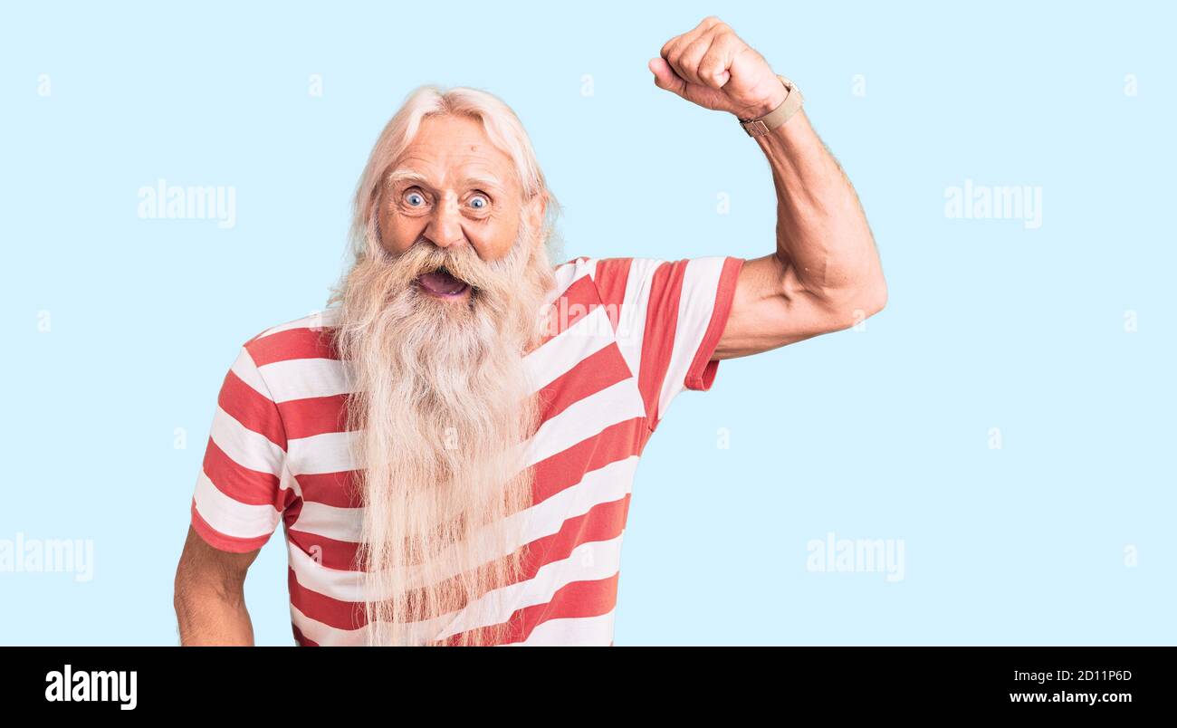 Old senior man with grey hair and long beard wearing striped tshirt ...