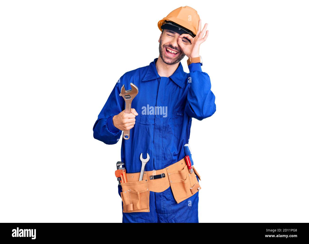 Young hispanic man wearing electrician uniform holding wrench smiling ...
