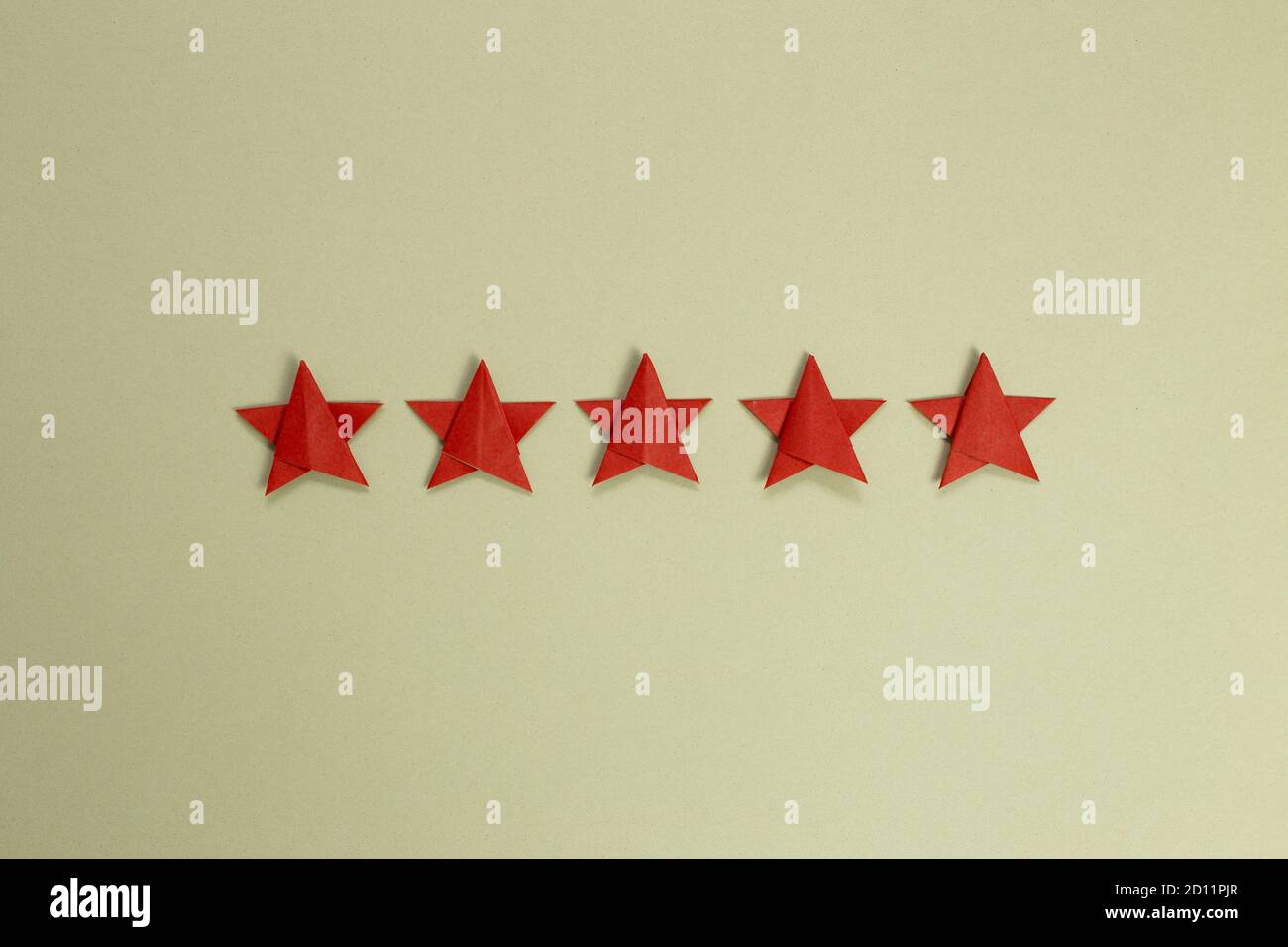 Five stars quality rating on khaki green background Stock Photo - Alamy