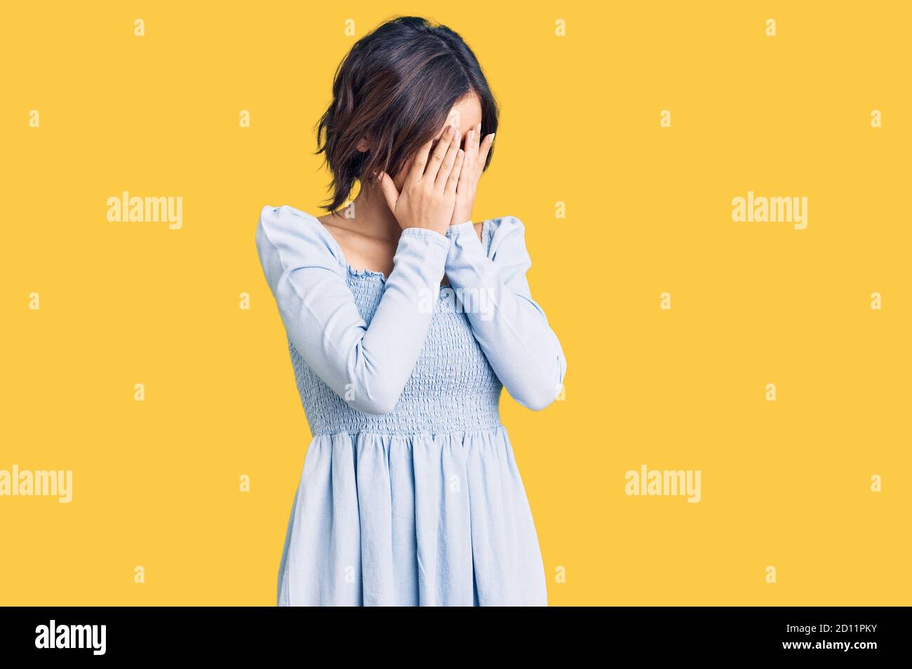 Young beautiful girl wearing casual clothes with sad expression ...