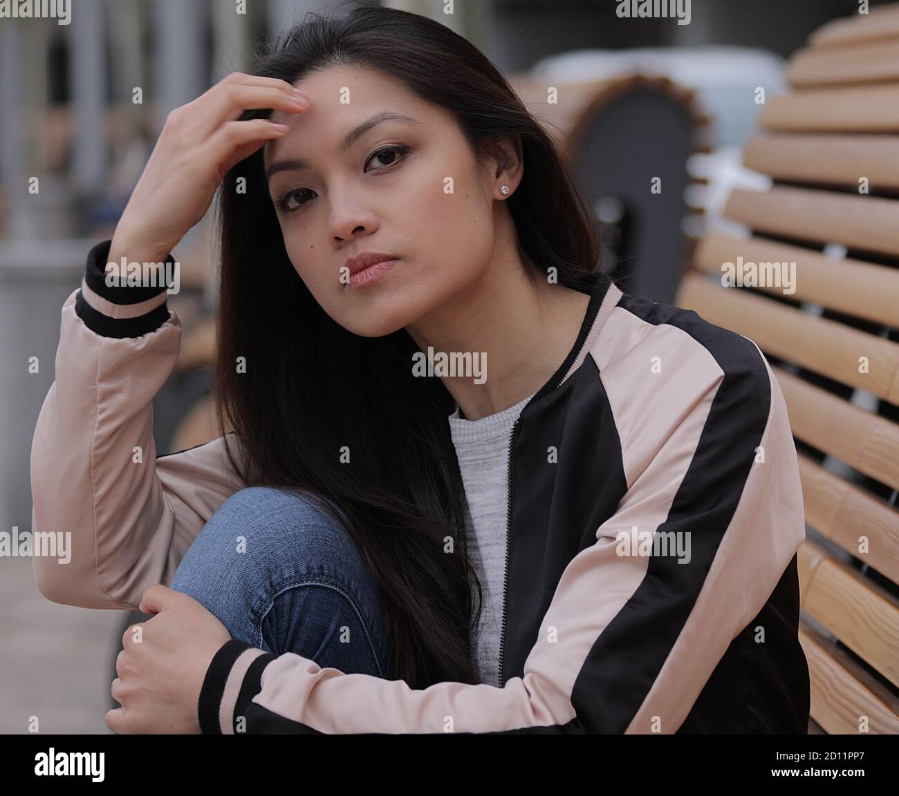 Pretty Asian girl in an urban aera Stock Photo - Alamy