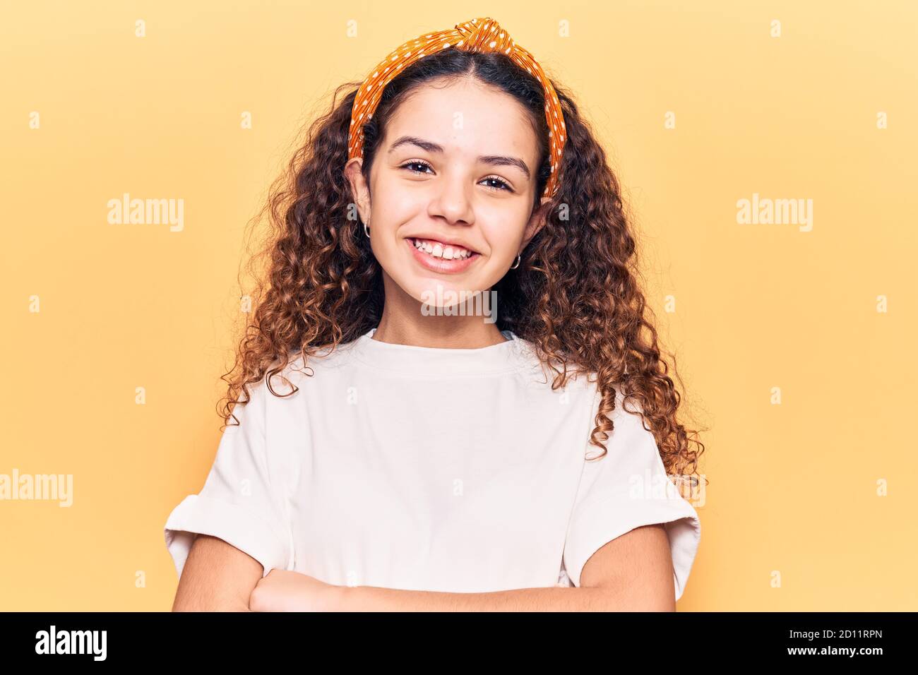 Beautiful kid girl with curly hair wearing casual clothes happy face ...