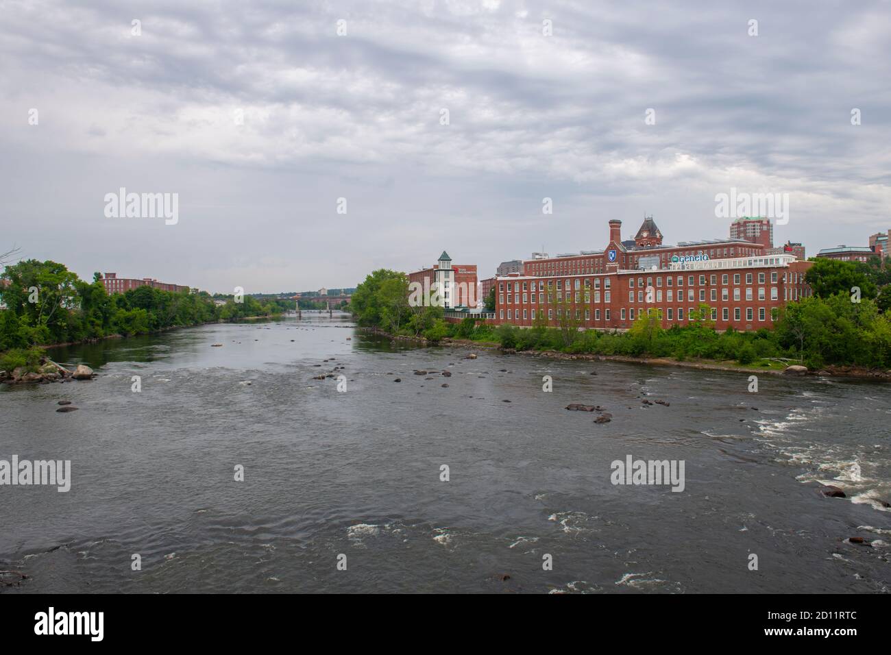 Historic Amoskeag Mill buildings at the bank of Merrimack River in ...