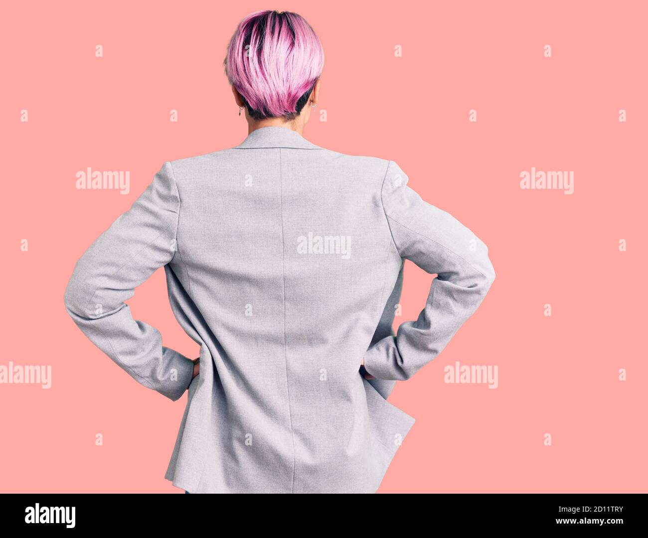 Young beautiful woman with pink hair wearing casual clothes standing ...