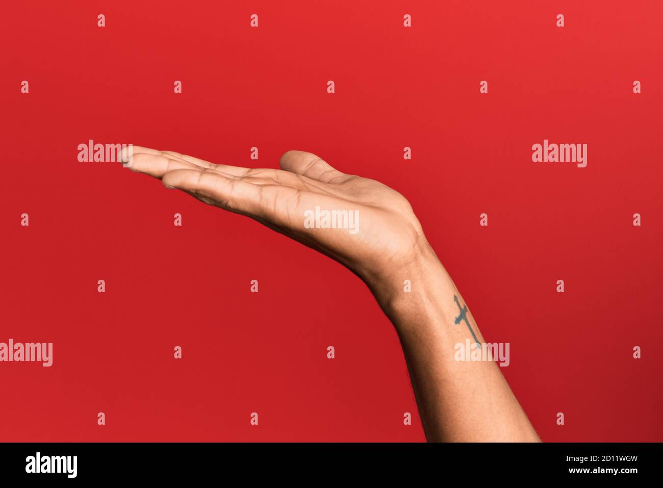 Hand of hispanic man over red isolated background with flat palm ...