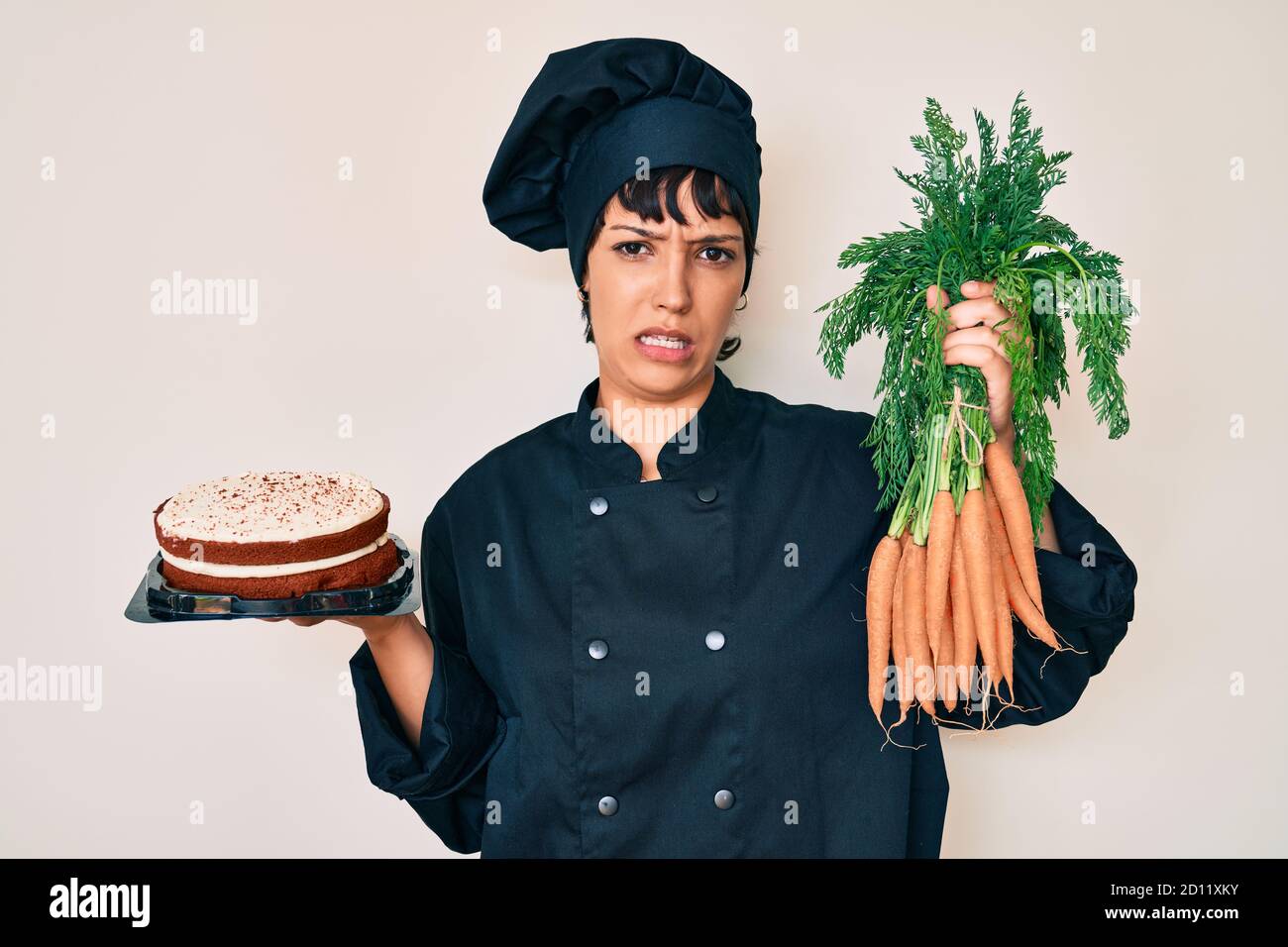 Beautiful brunettte woman chef cooking carrot cake clueless and ...