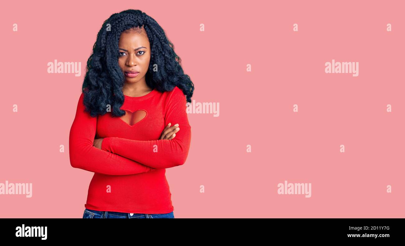 Beautiful african american woman wearing casual clothes skeptic and ...
