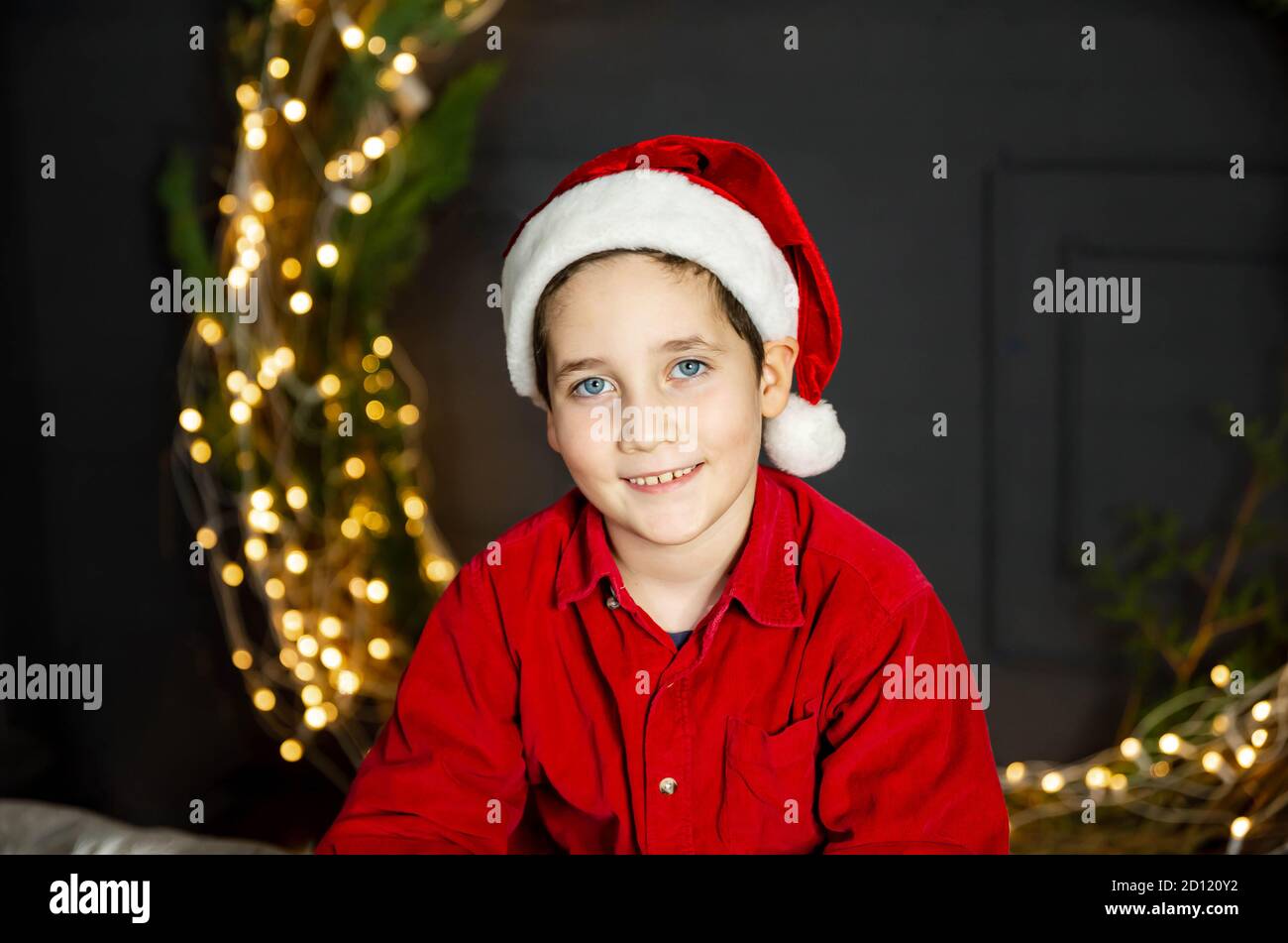Kid having fun at home. Cute smiling boy celebrates Christmas Stock ...