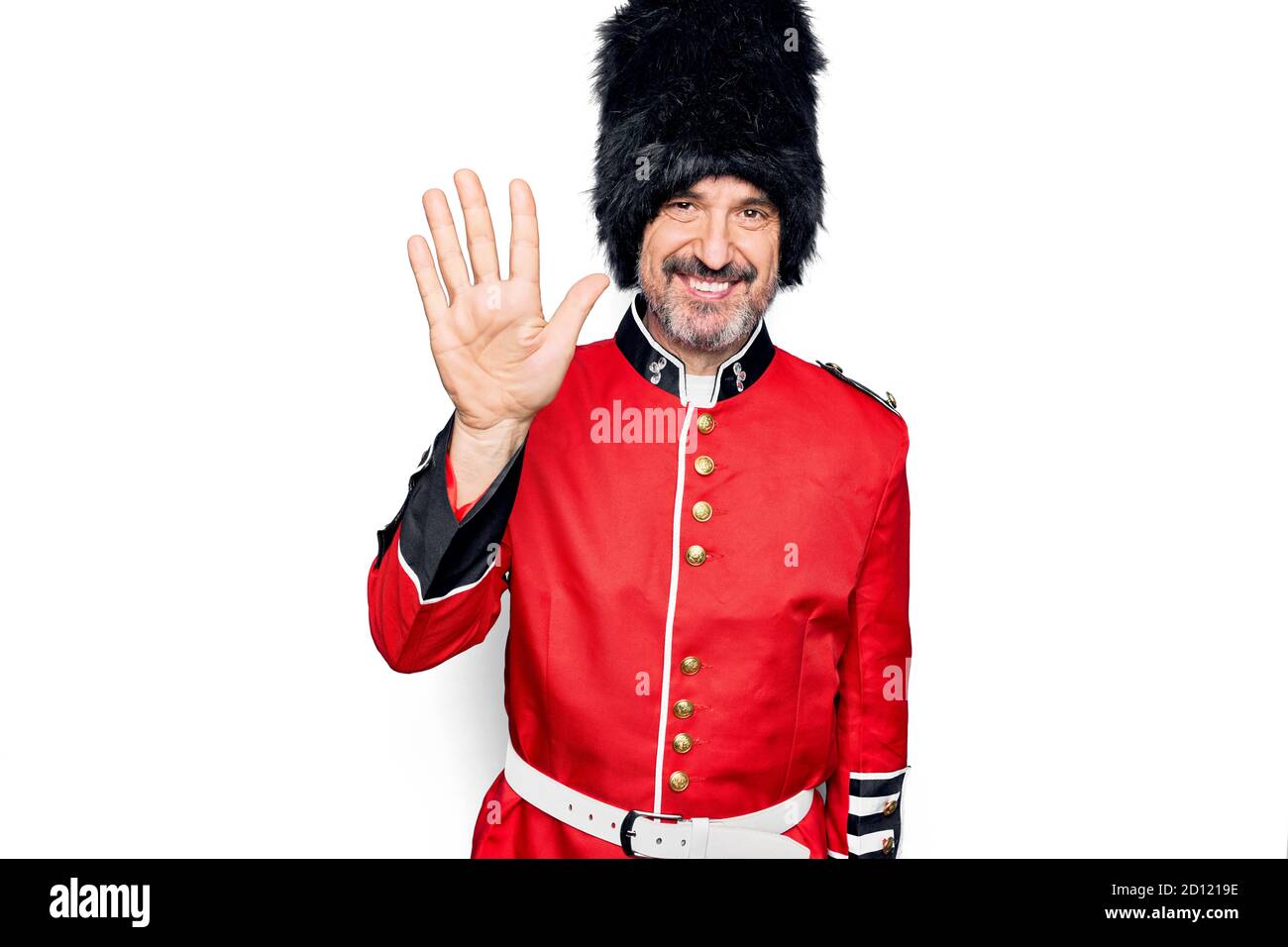 Middle age handsome wales guard man wearing traditional uniform over ...
