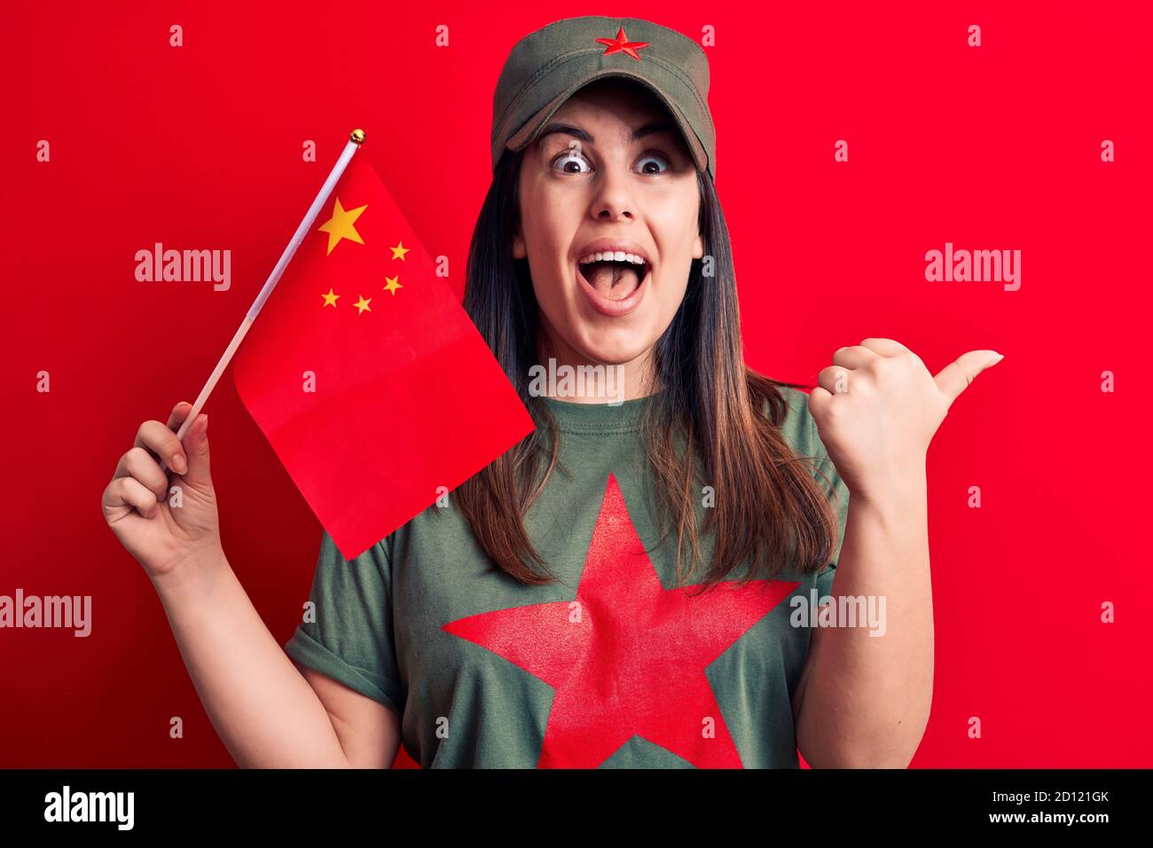 Beautiful patriotic woman wearing t-shirt with red star communist ...
