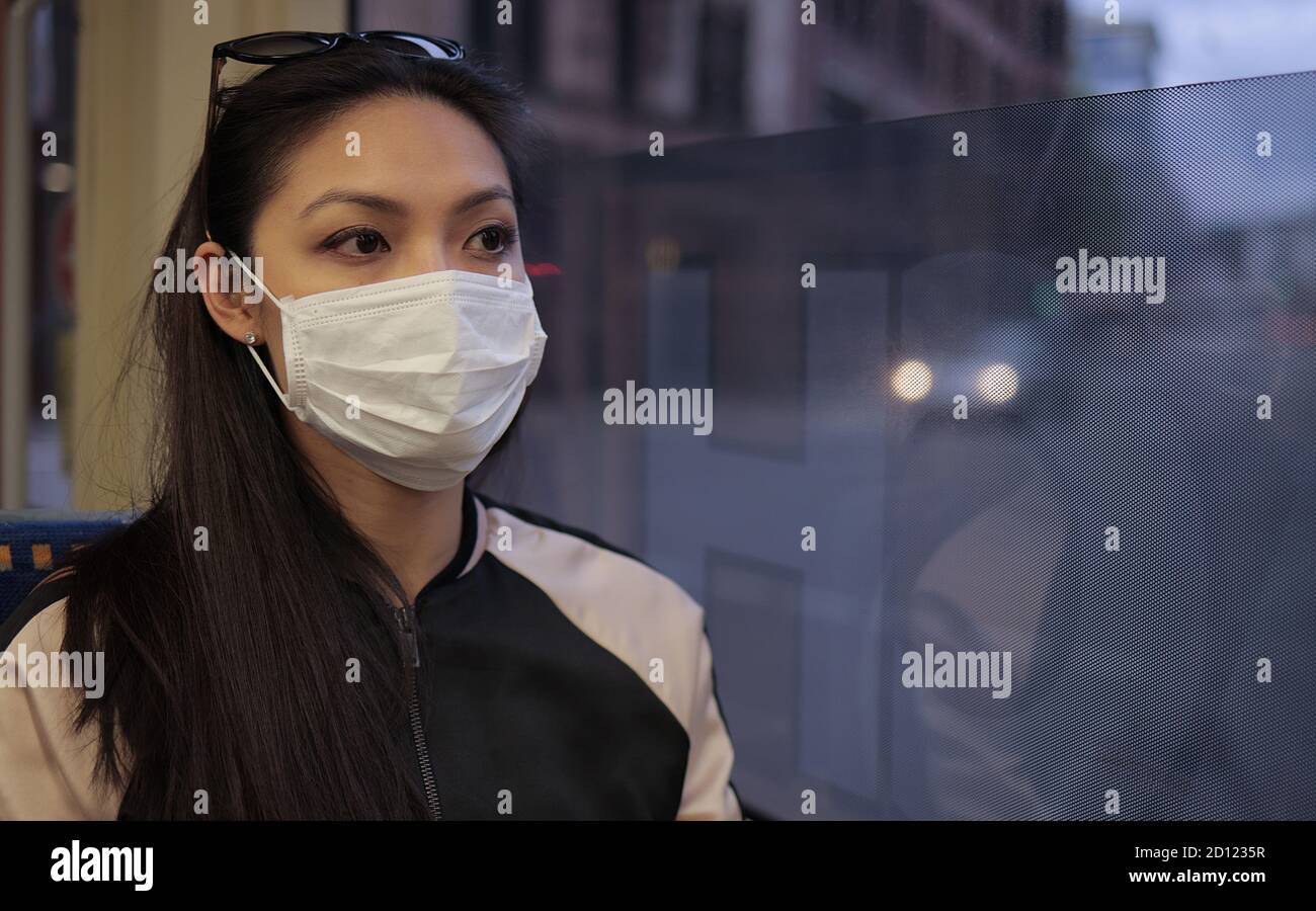Wearing a face mask while driving in a tram Stock Photo - Alamy