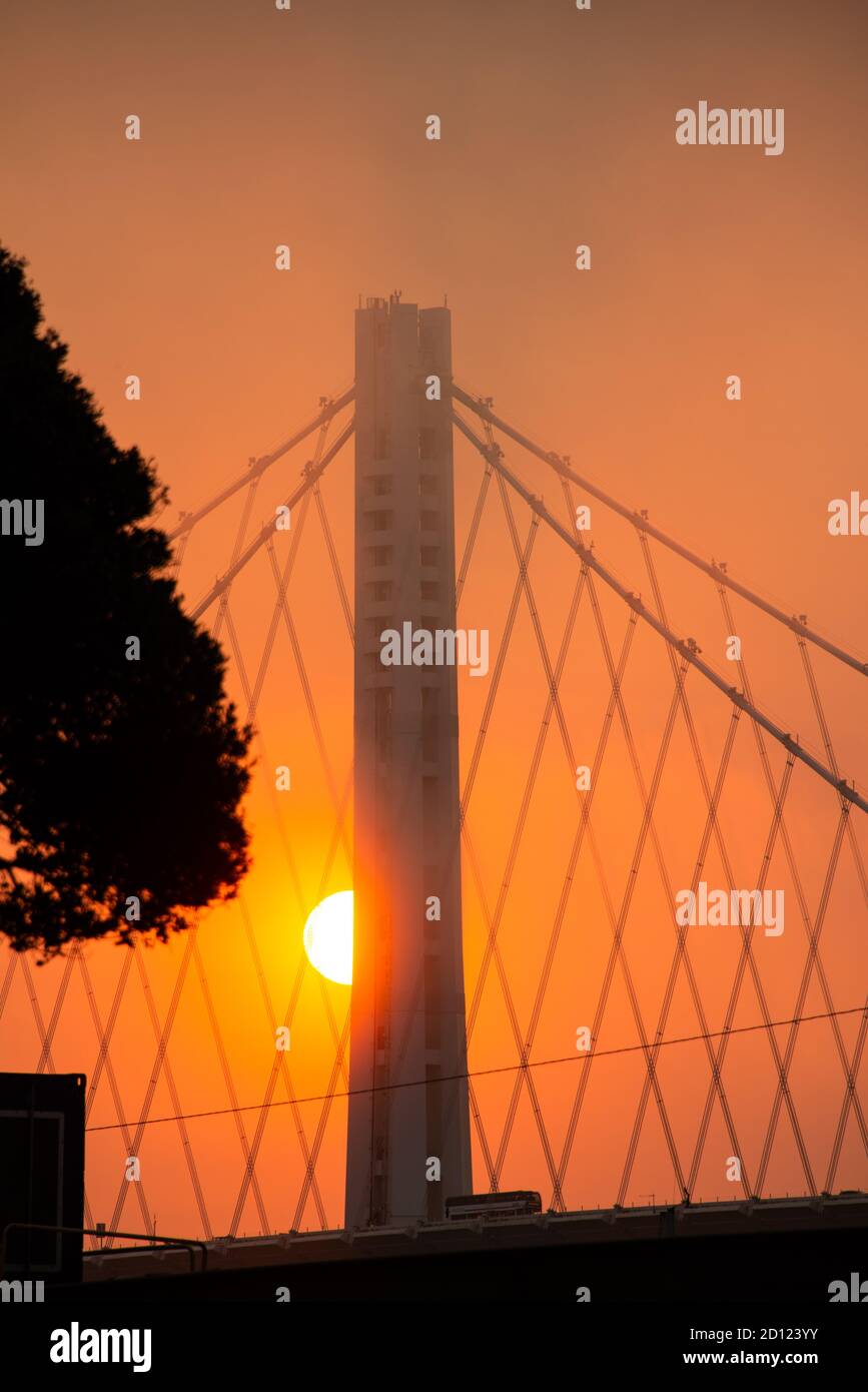 Eerie orange sky over Bay Bridge in San Francisco, zoom in vertical ...