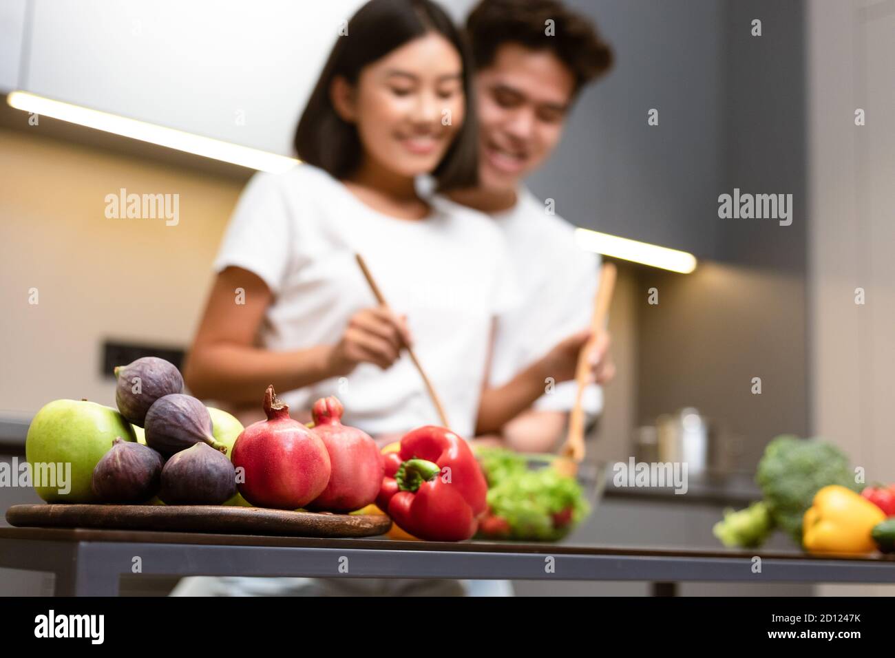 Korean Family Couple Cooking Together Hugging Standing In Kitchen ...