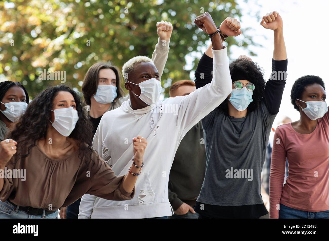 Young angry people making riot on the street Stock Photo - Alamy
