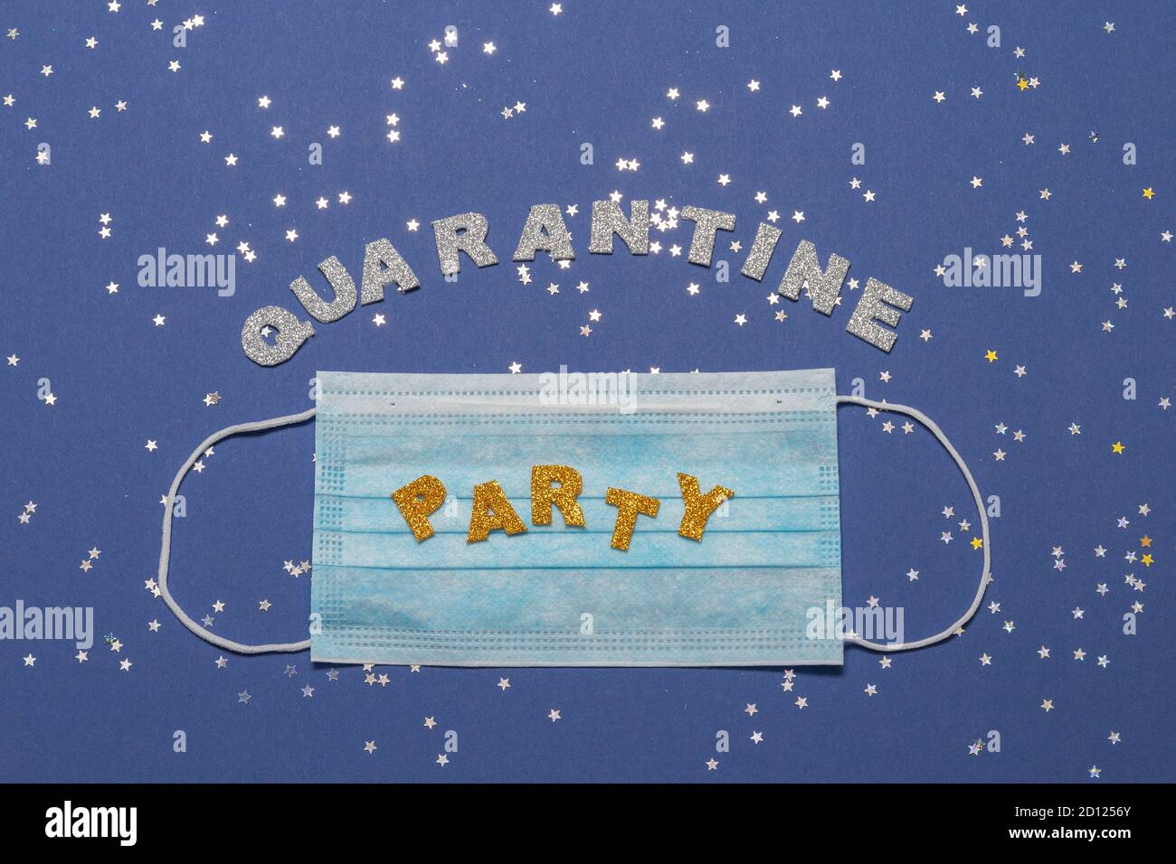 Medical protective mask on blue background. Inscription Quarantine ...