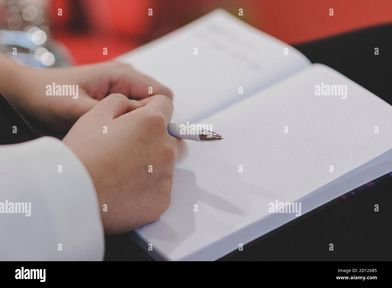 Writing paper notes at buseinss presentation.Businessman having ...