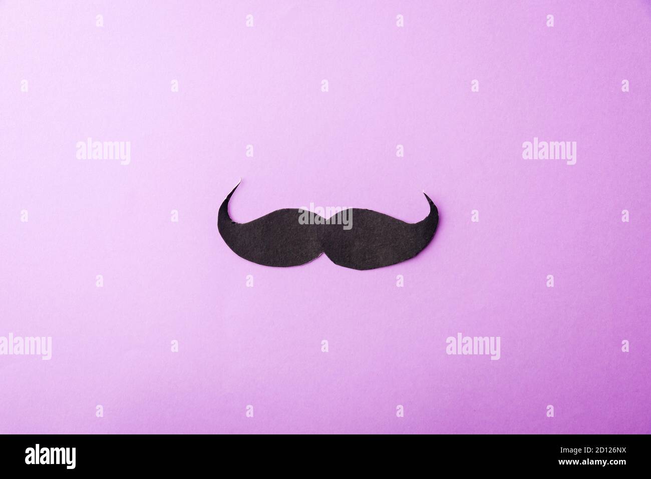 Black mustache paper, studio shot isolated on purple background ...