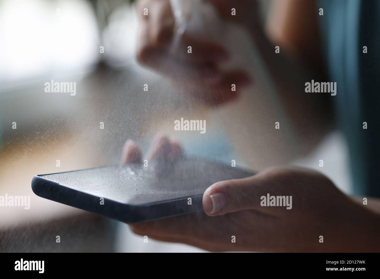 Woman disinfect hands mobile hi-res stock photography and images - Alamy