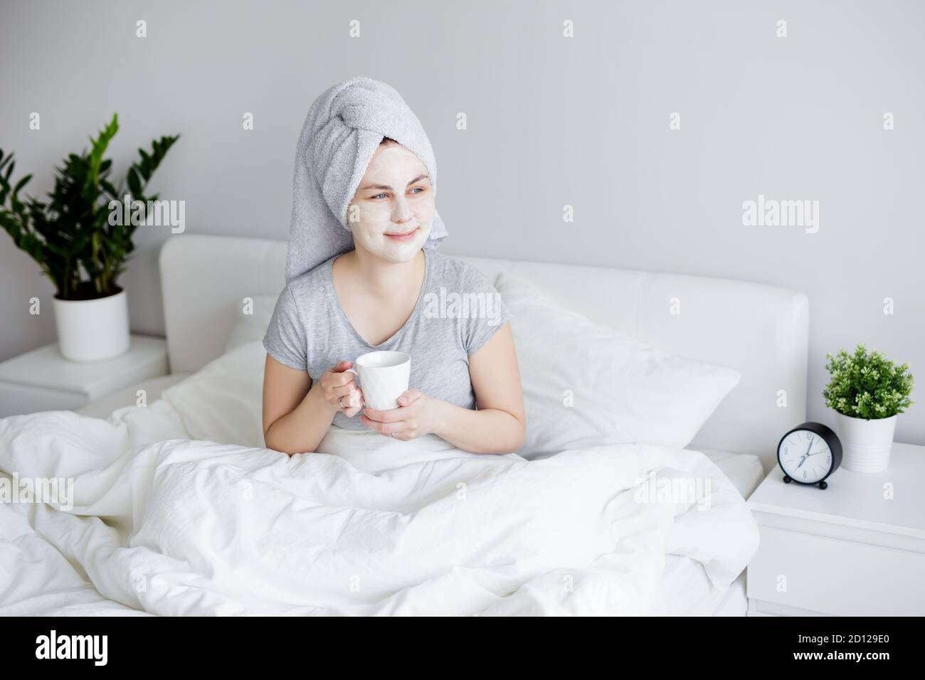 good morning and skin care concept - portrait of young woman with ...