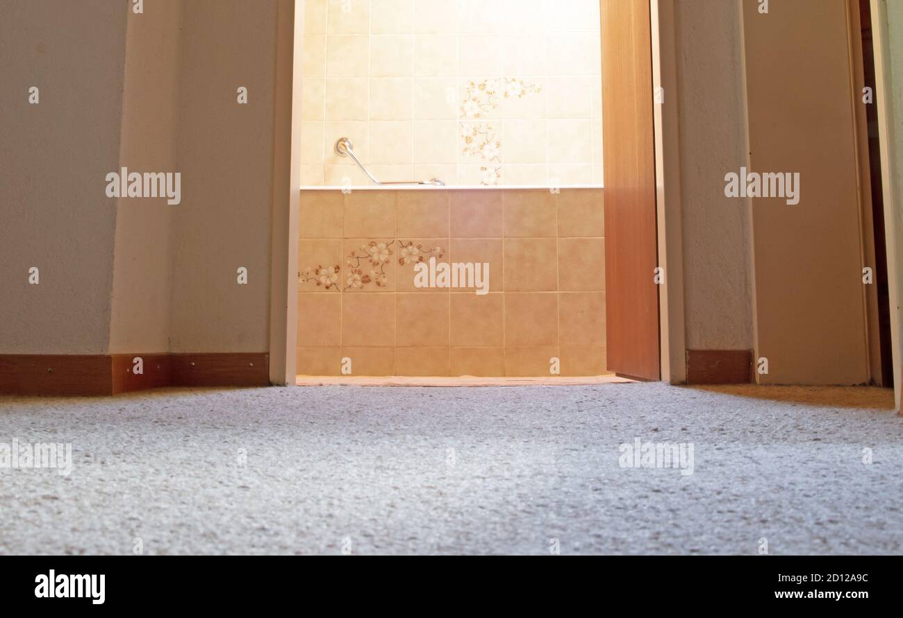 Old bathroom, brown tiled, view from the outside Stock Photo - Alamy