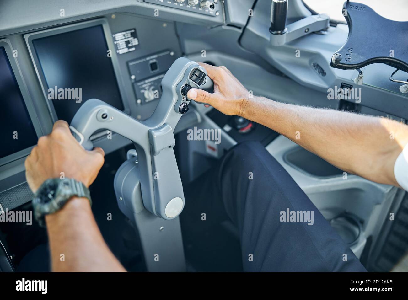 Male pilot in cockpit flying passenger plane Stock Photo - Alamy