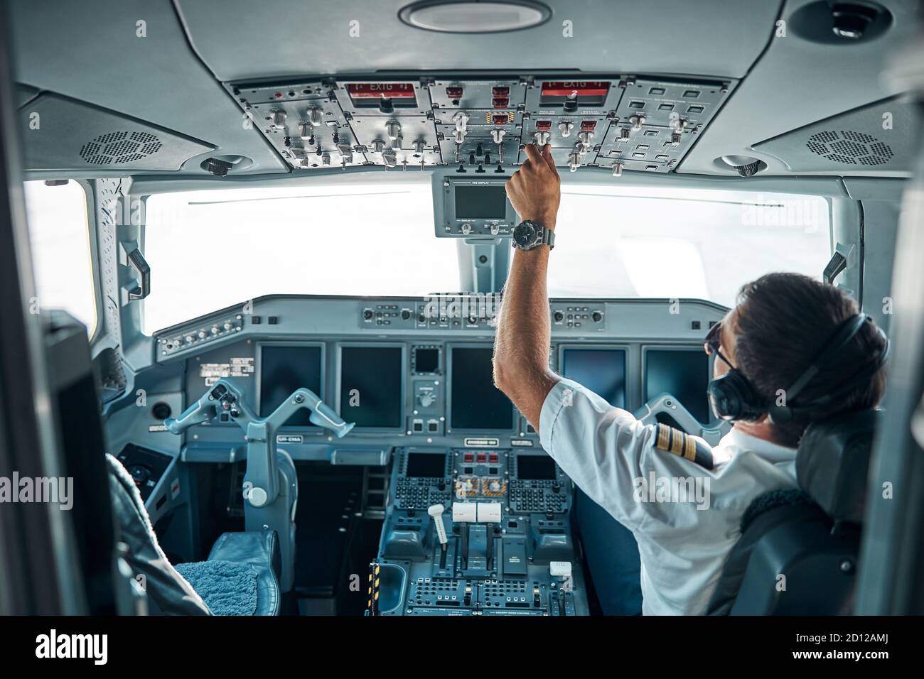 Male professional getting ready for taking off jet Stock Photo - Alamy
