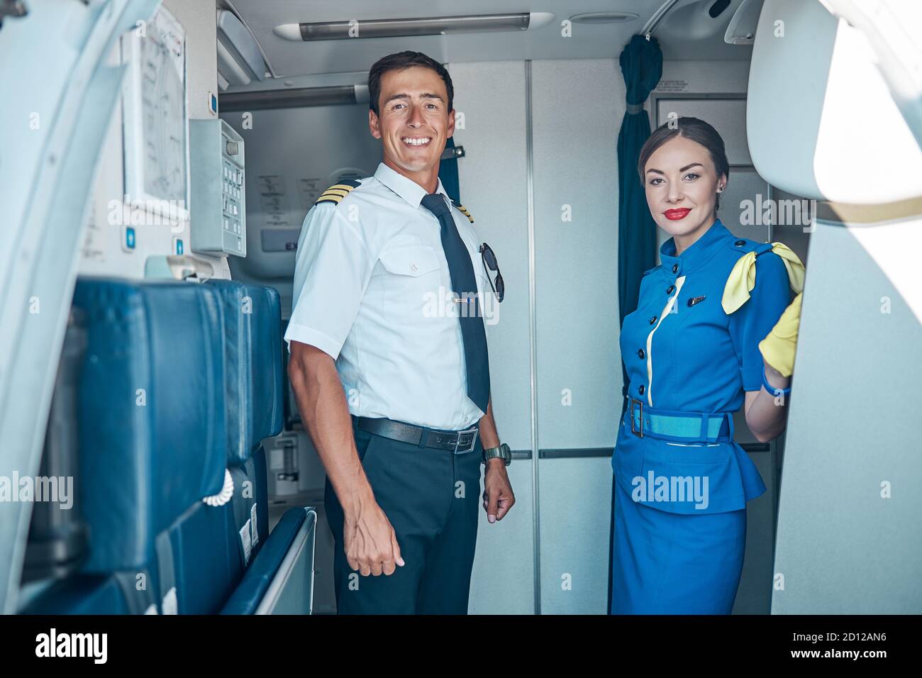 Smiling crew before taking off enjoying work together Stock Photo - Alamy