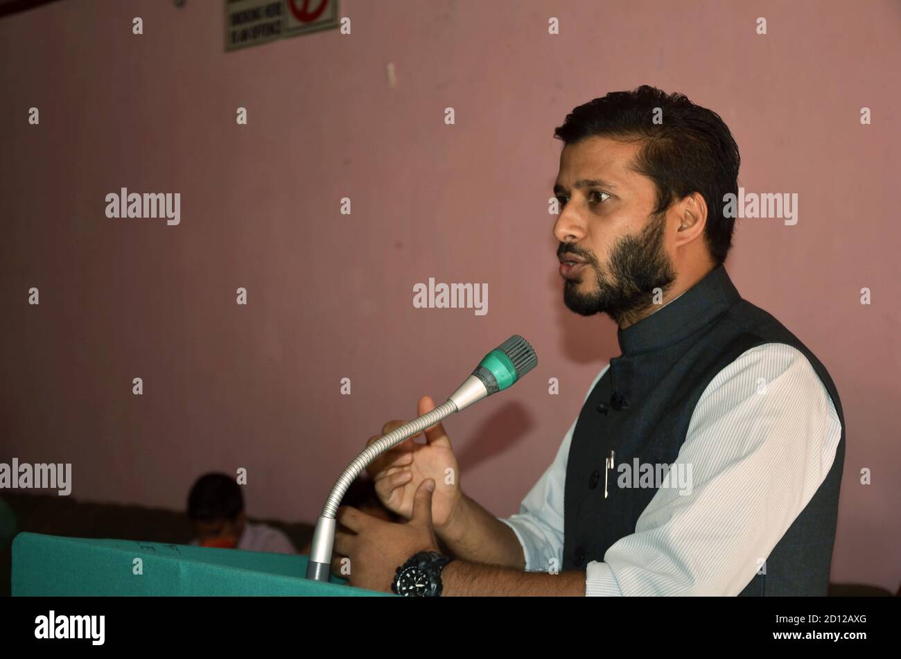 Man asian is giving lecture in a public hall during a function Stock ...