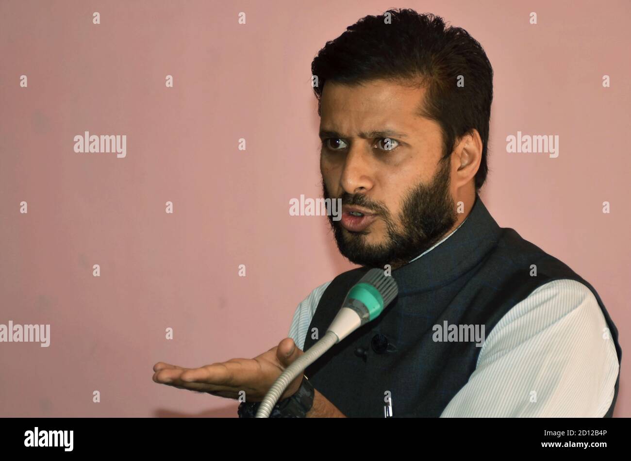 Man asian is giving lecture in a public hall during a function Stock ...