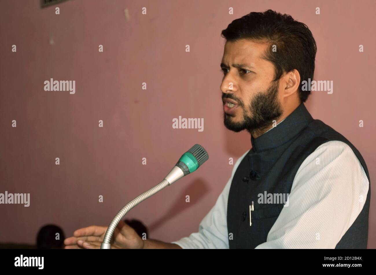 Man asian is giving lecture in a public hall during a function Stock ...