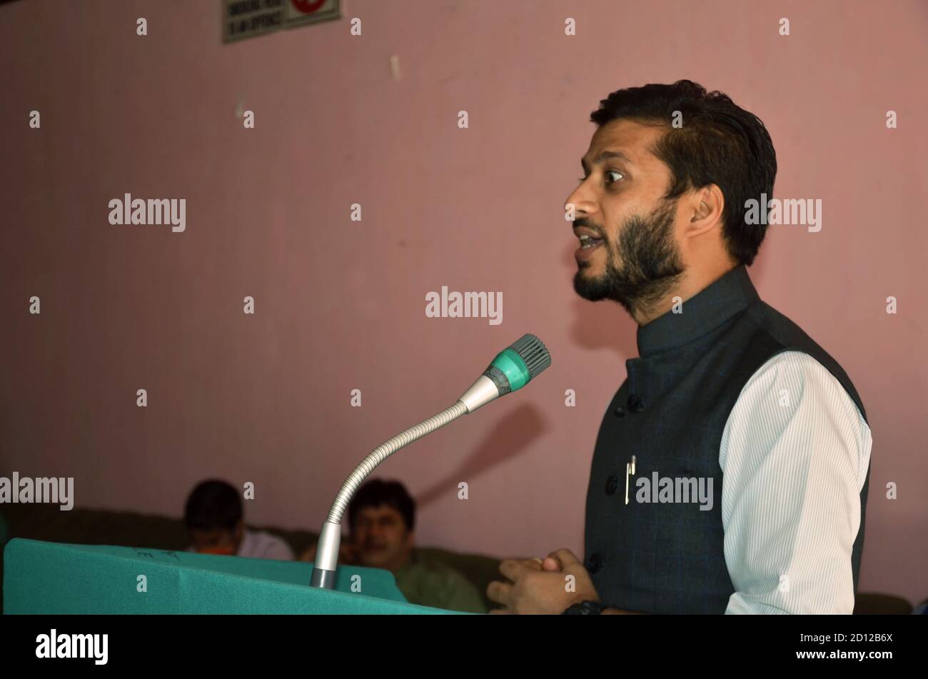 Man asian is giving lecture in a public hall during a function Stock ...