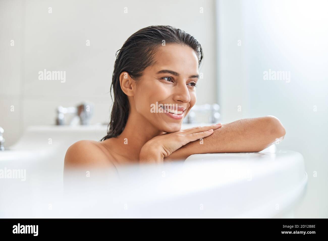 Positive young woman white bath hi-res stock photography and images - Alamy