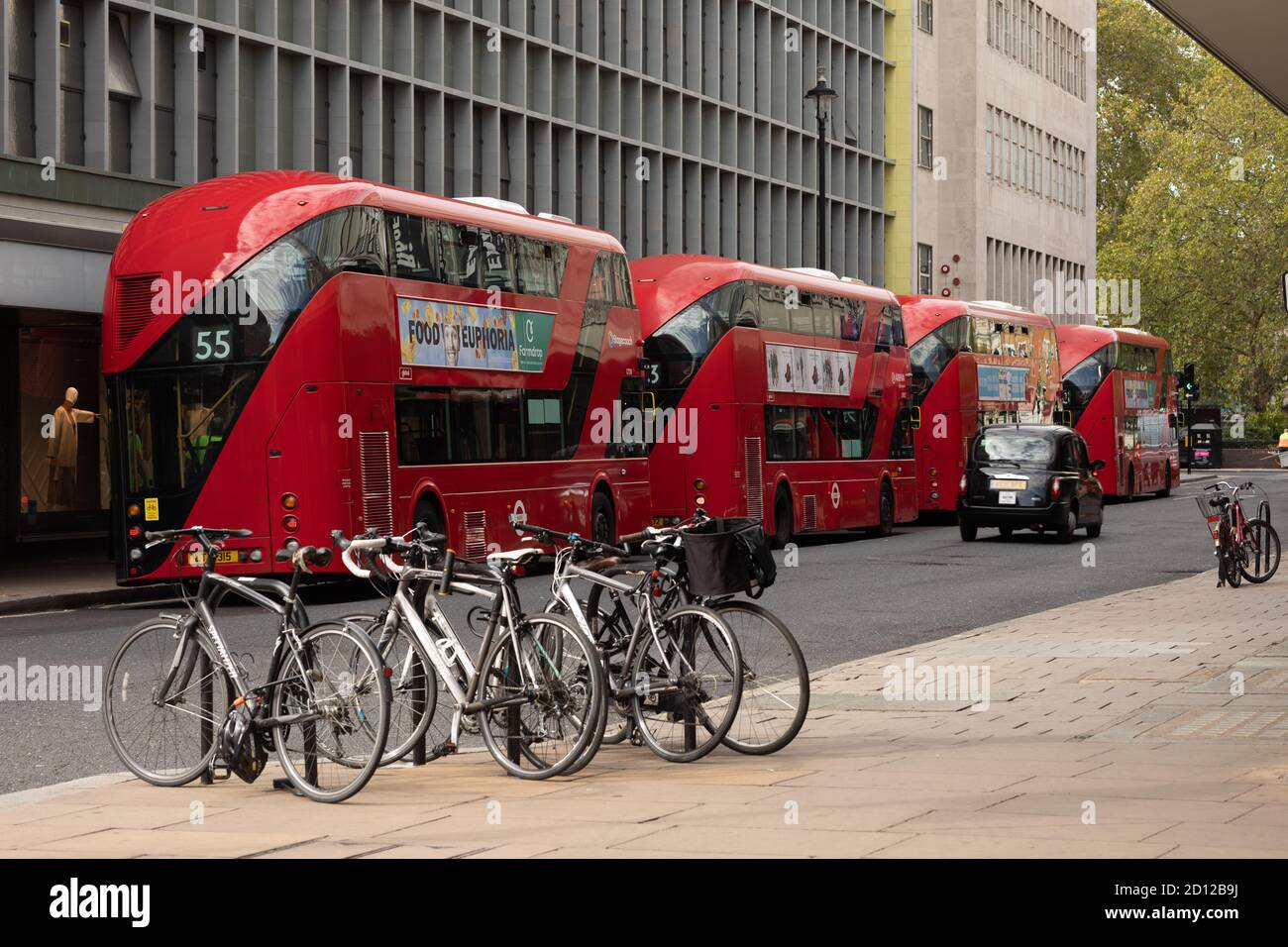 London Buses Bikes Taxis and Ambulances Stock Photo - Alamy