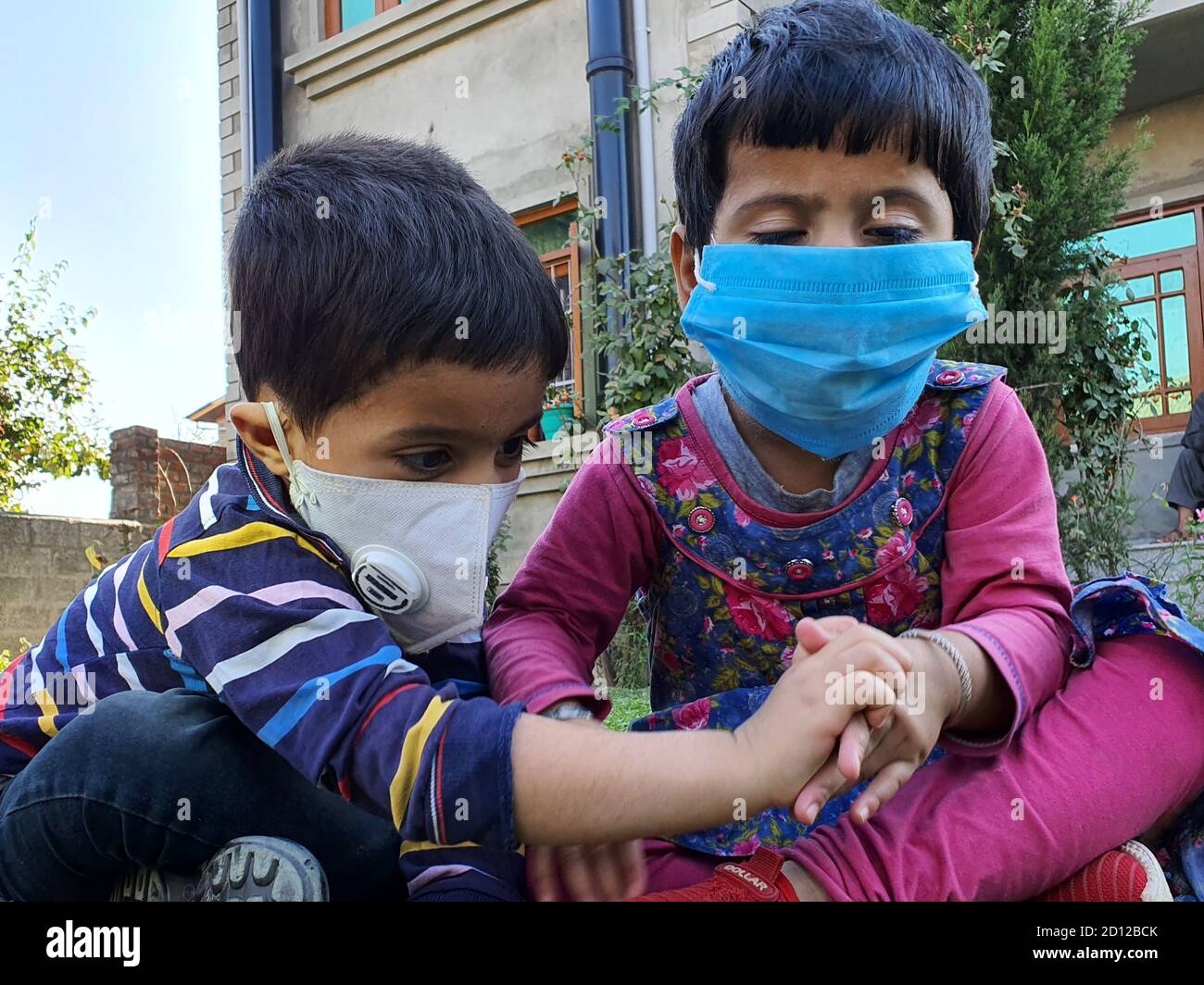 Kids play wearing mask after the coronavirus lockdown in asian ...