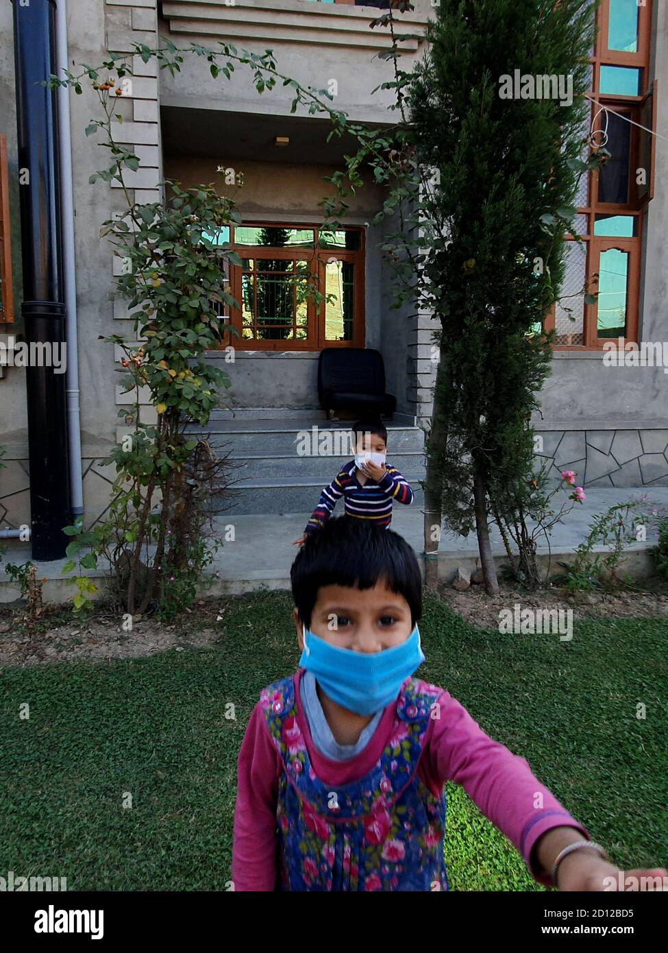 Kids play wearing mask after the coronavirus lockdown in asian ...