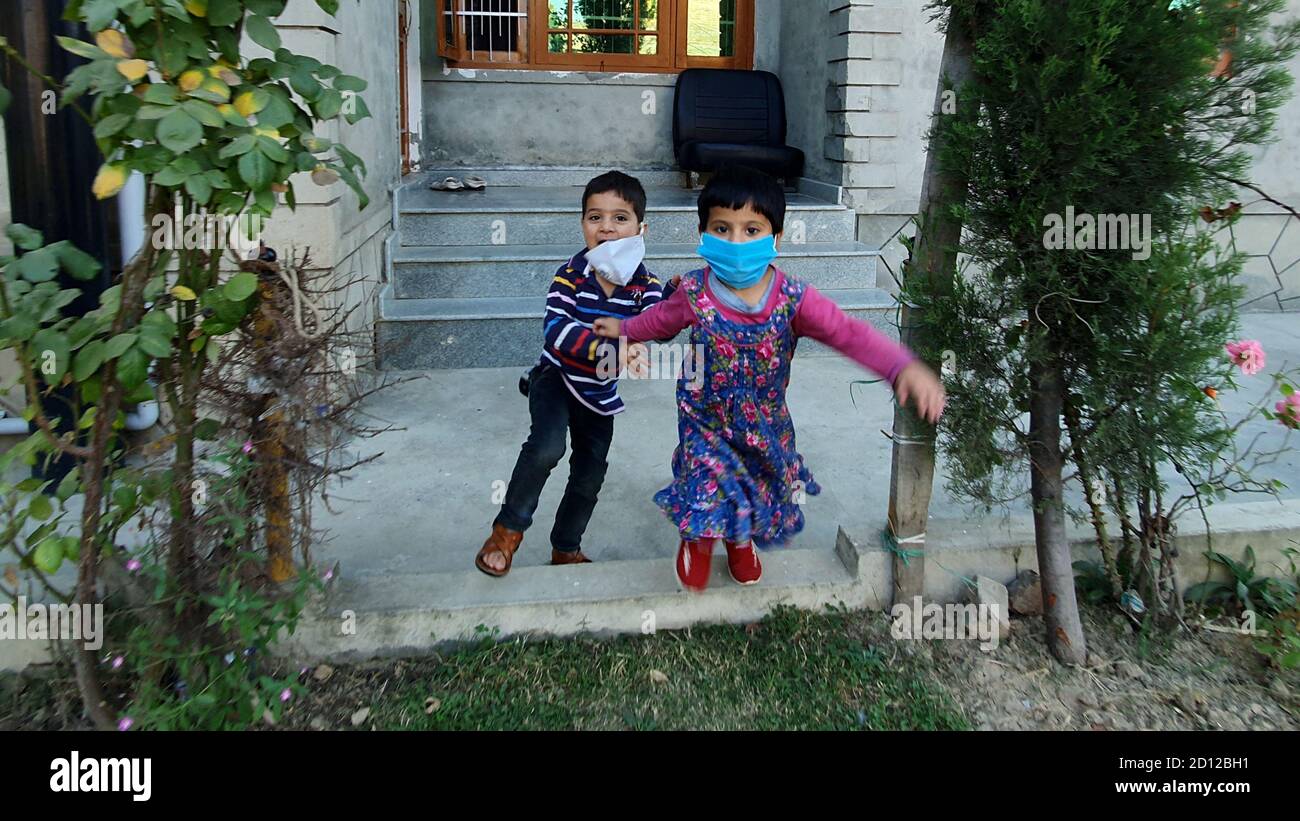 Kids play wearing mask after the coronavirus lockdown in asian ...