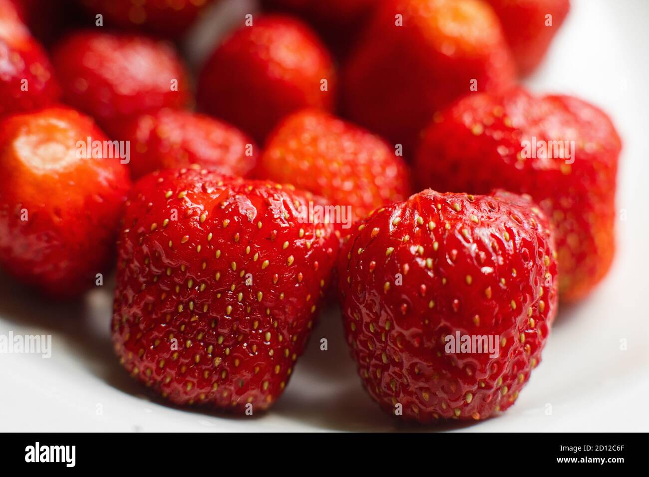 Macro of strawberries texture in sunlight Stock Photo - Alamy