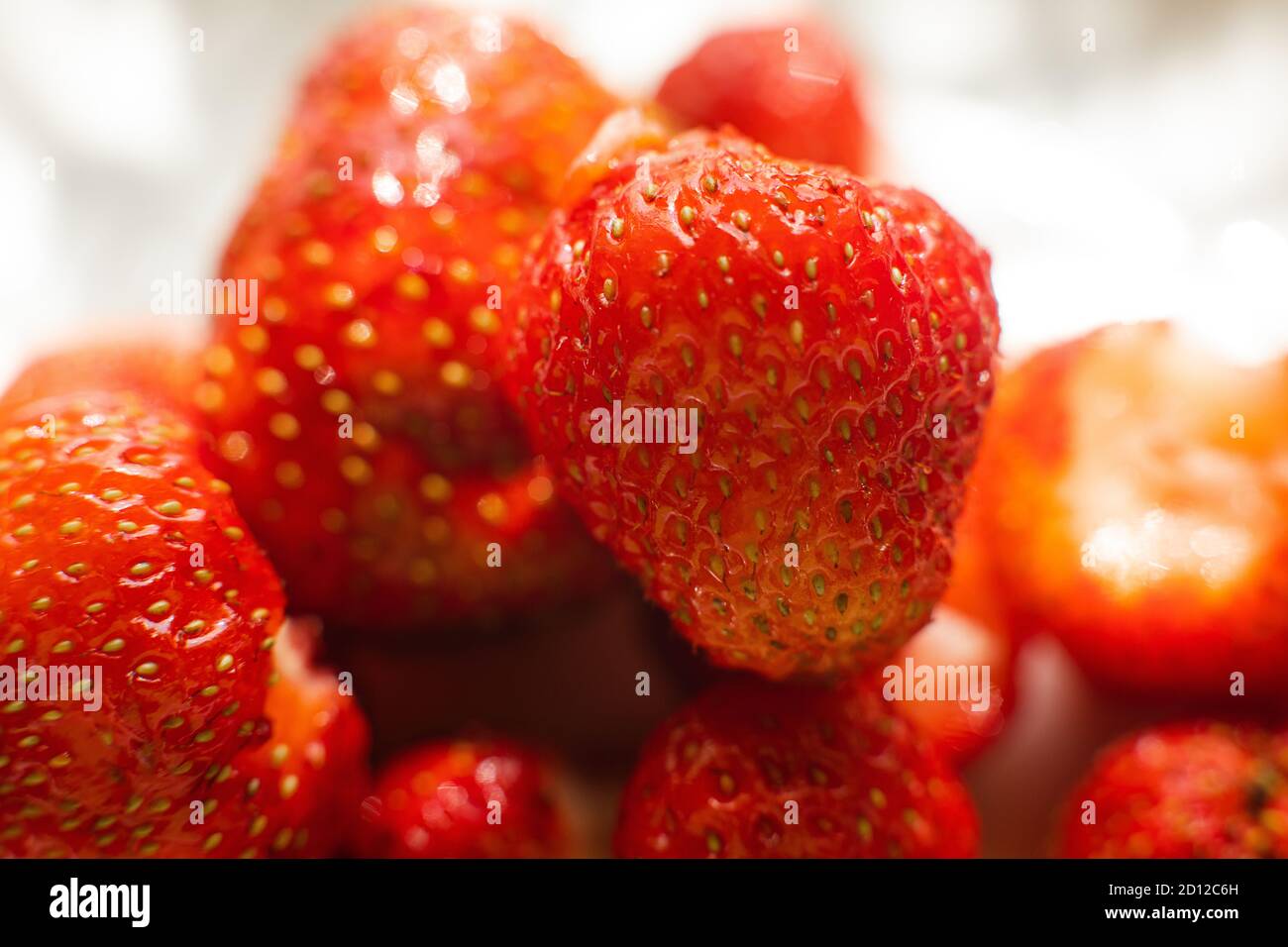 Macro of strawberries texture in sunlight Stock Photo - Alamy