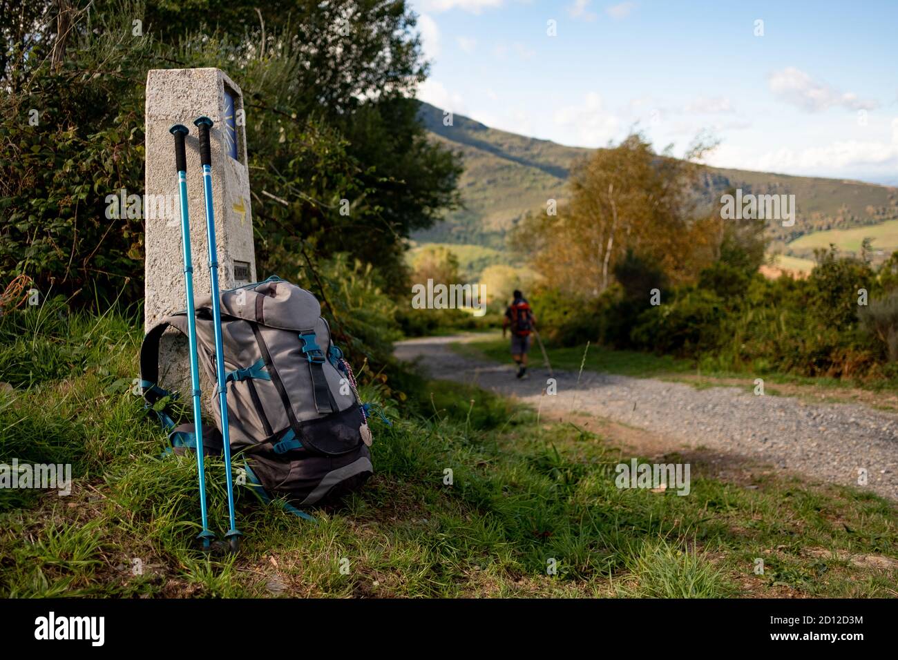 Close up of backpack with walking stick and Camino de Santiago sign ...