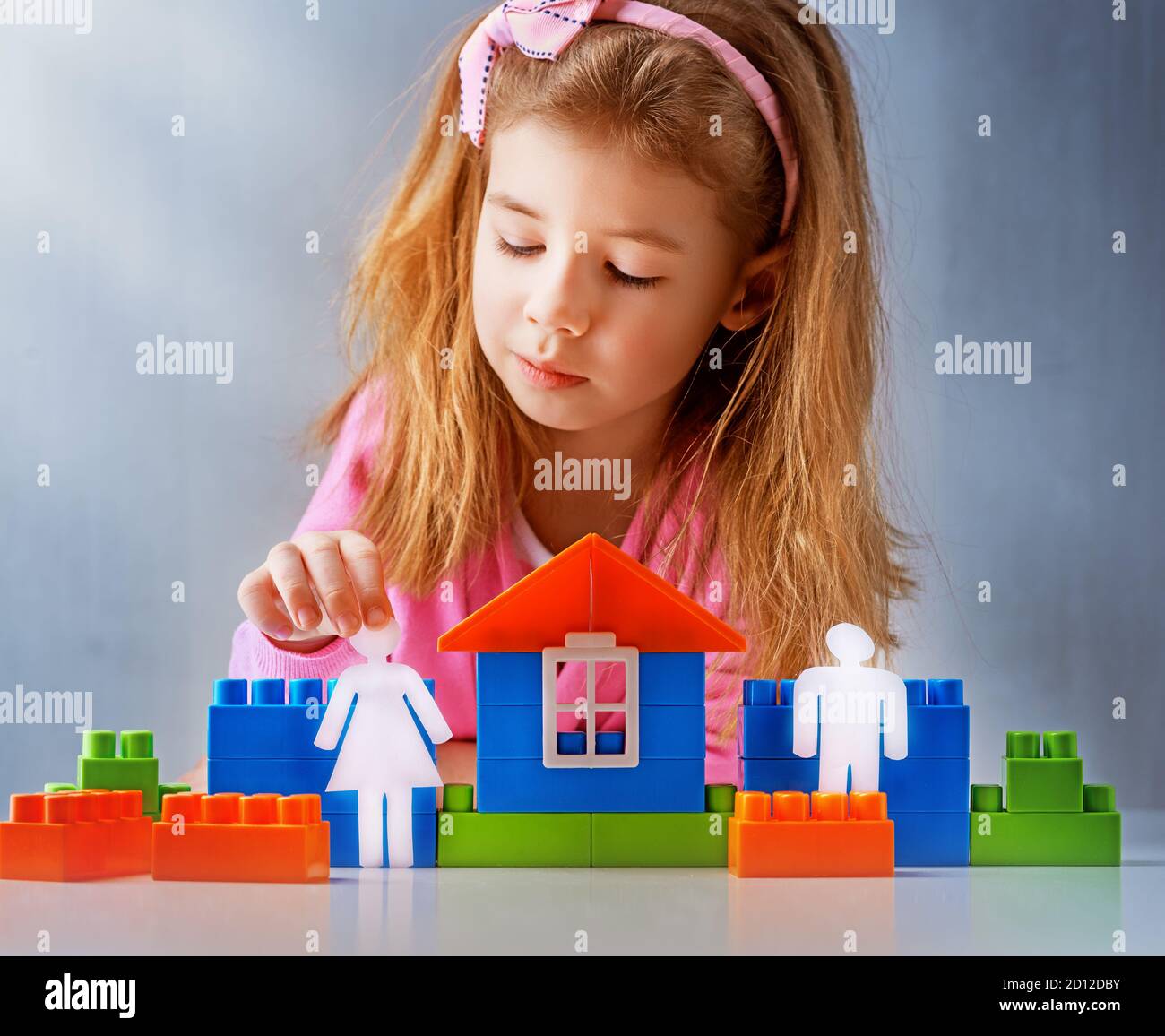 little child playing with toys Stock Photo - Alamy