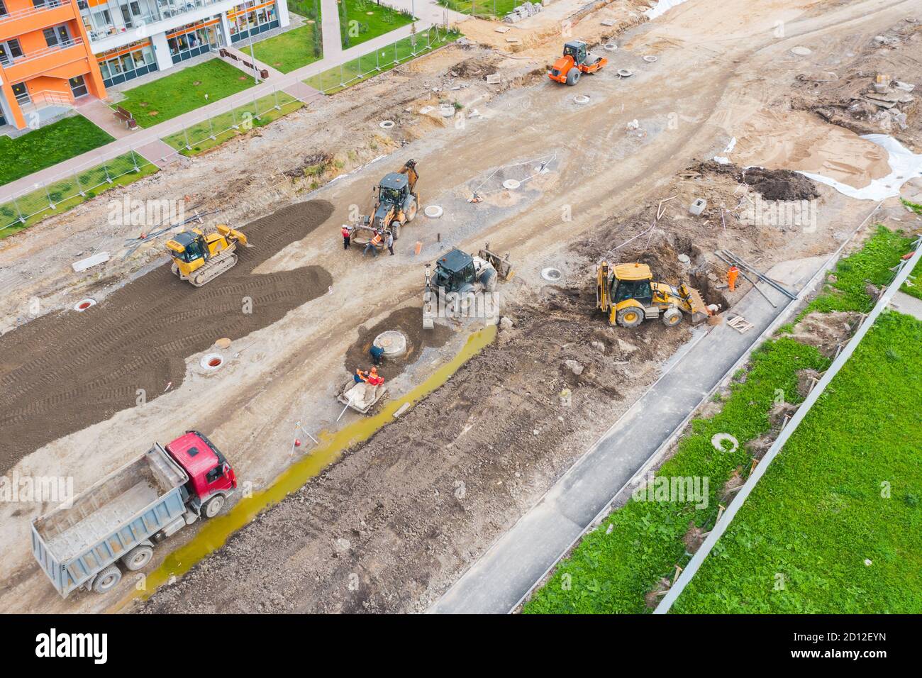 Construction of a city street, laying of communications, installation ...