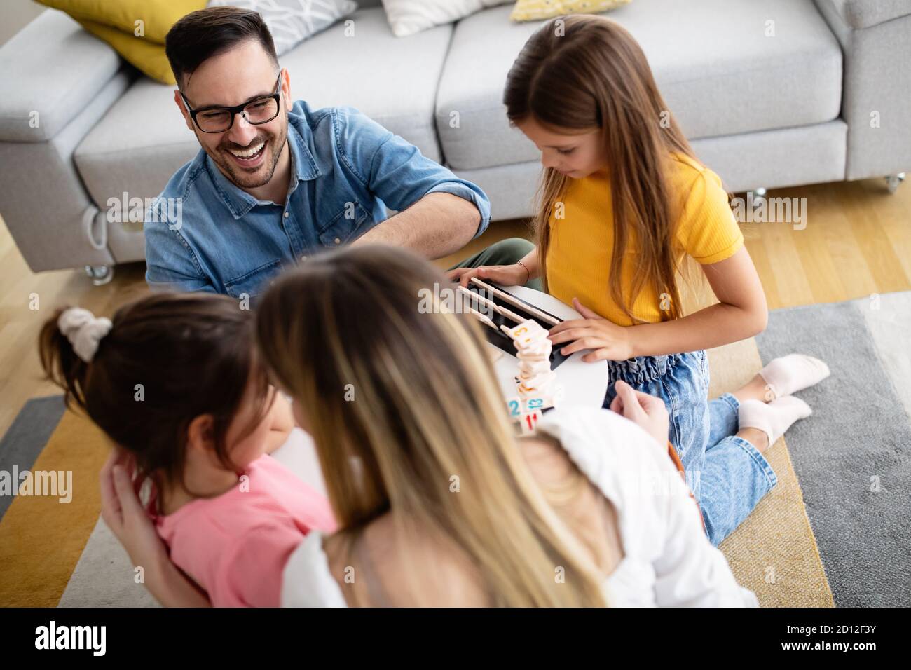 Happy family having fun times at home Stock Photo - Alamy
