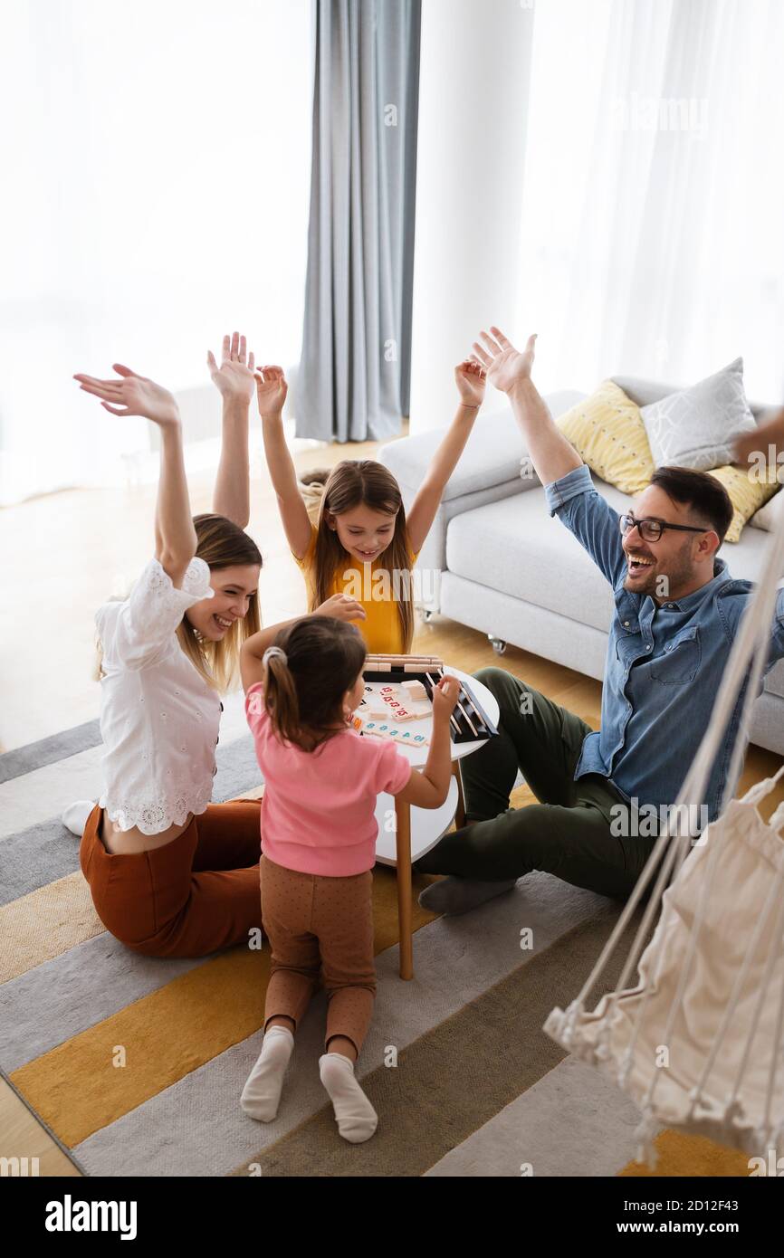 Happy family having fun times at home Stock Photo - Alamy