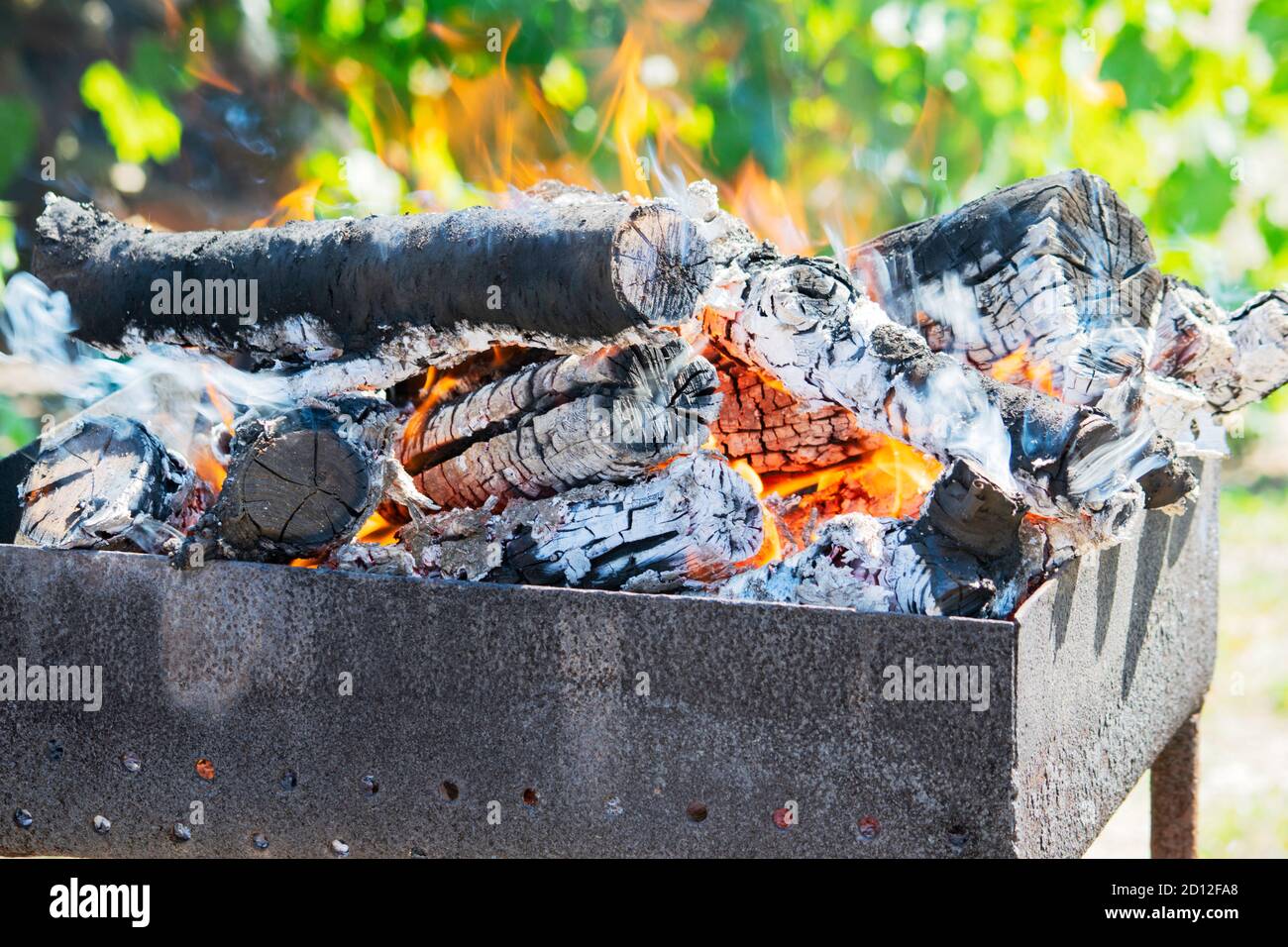 firewood burning on the brazier brazier, fire, coals, background Stock ...