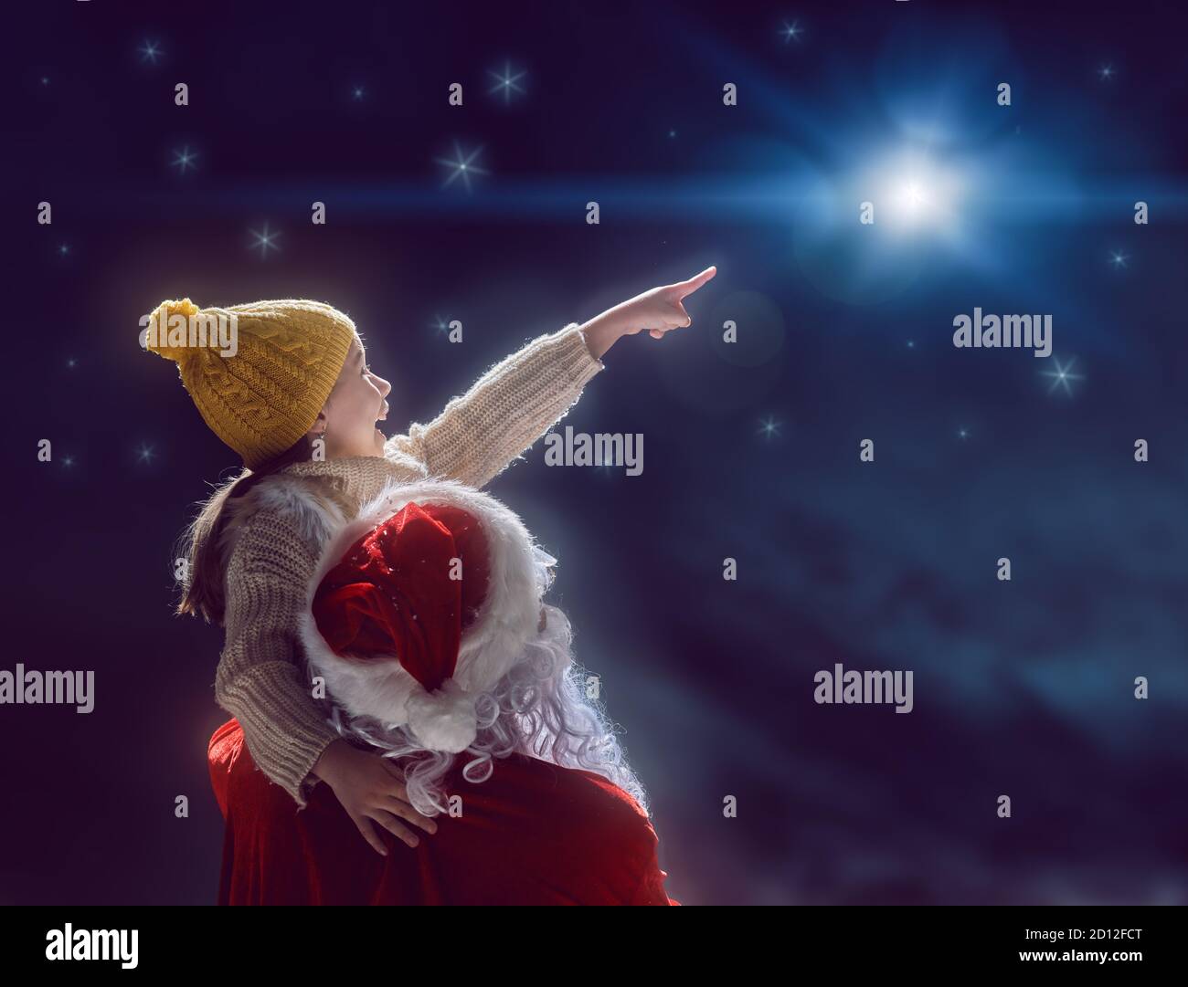 Merry Christmas and happy holidays! Cute little child girl and Santa ...