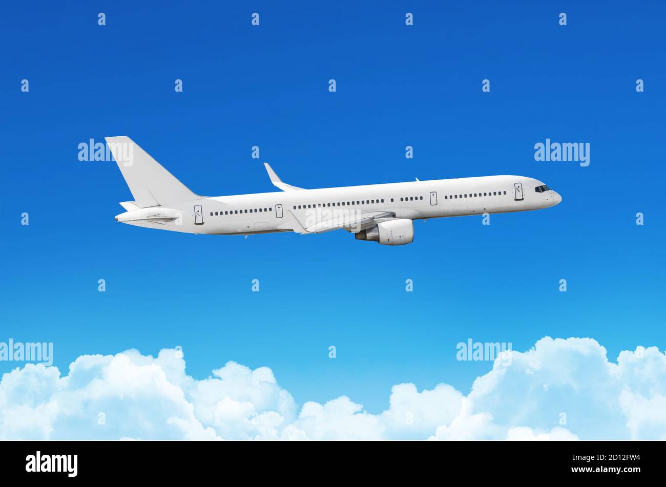 Passenger plane fly on a train above clouds and blue sky Stock Photo ...