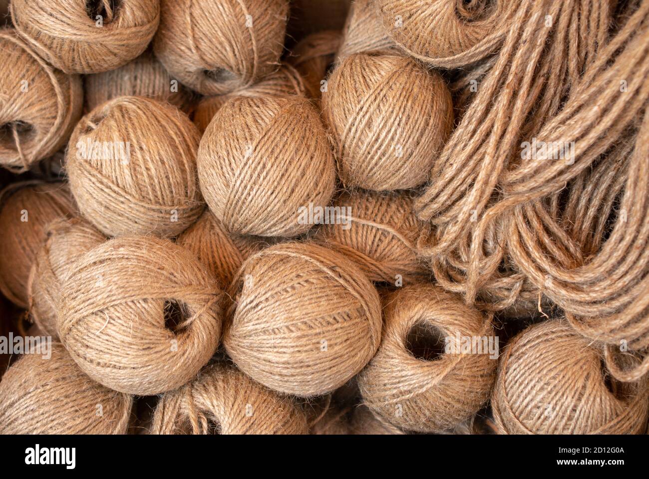 Plenty of spools or rolls of brown color linen string Stock Photo - Alamy