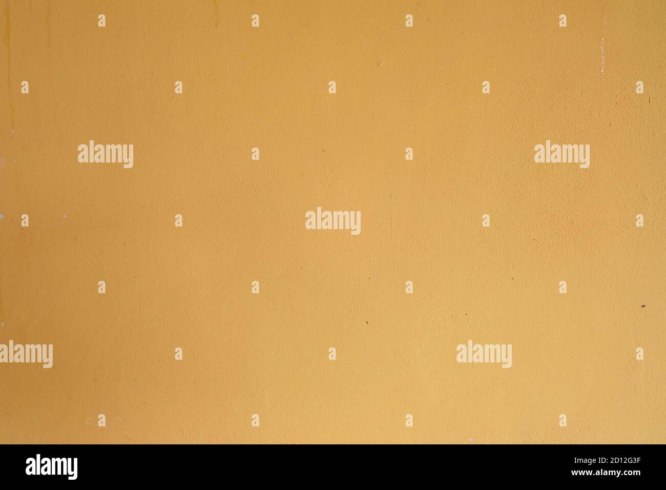 Stained yellow cement wall background and texture Stock Photo - Alamy