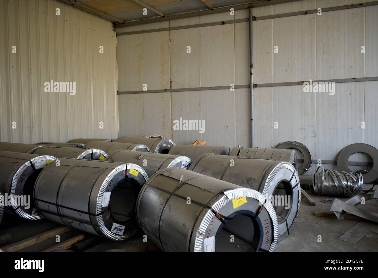 Rolls of steel sheet stored in warehouse; galvanized steel coil in the ...